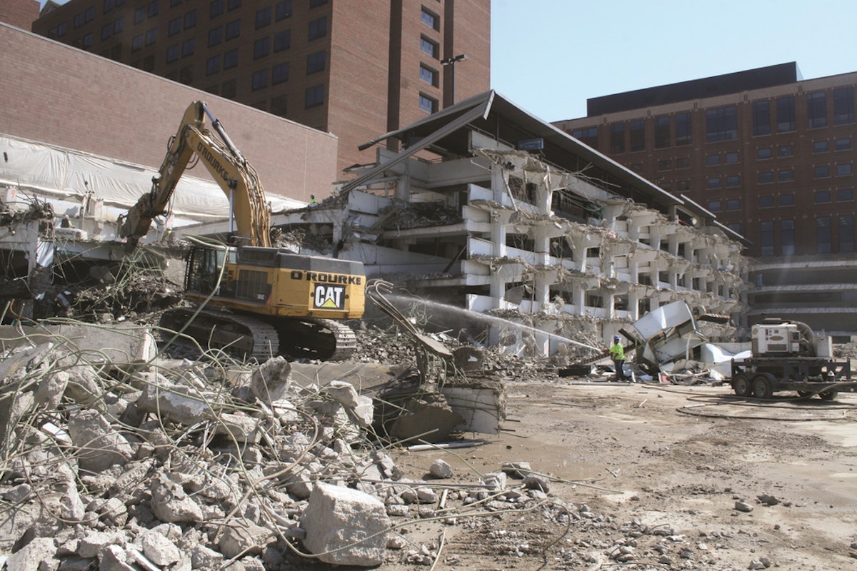 Combination of Demolition Techniques Remove Parking Garage Attached to ...