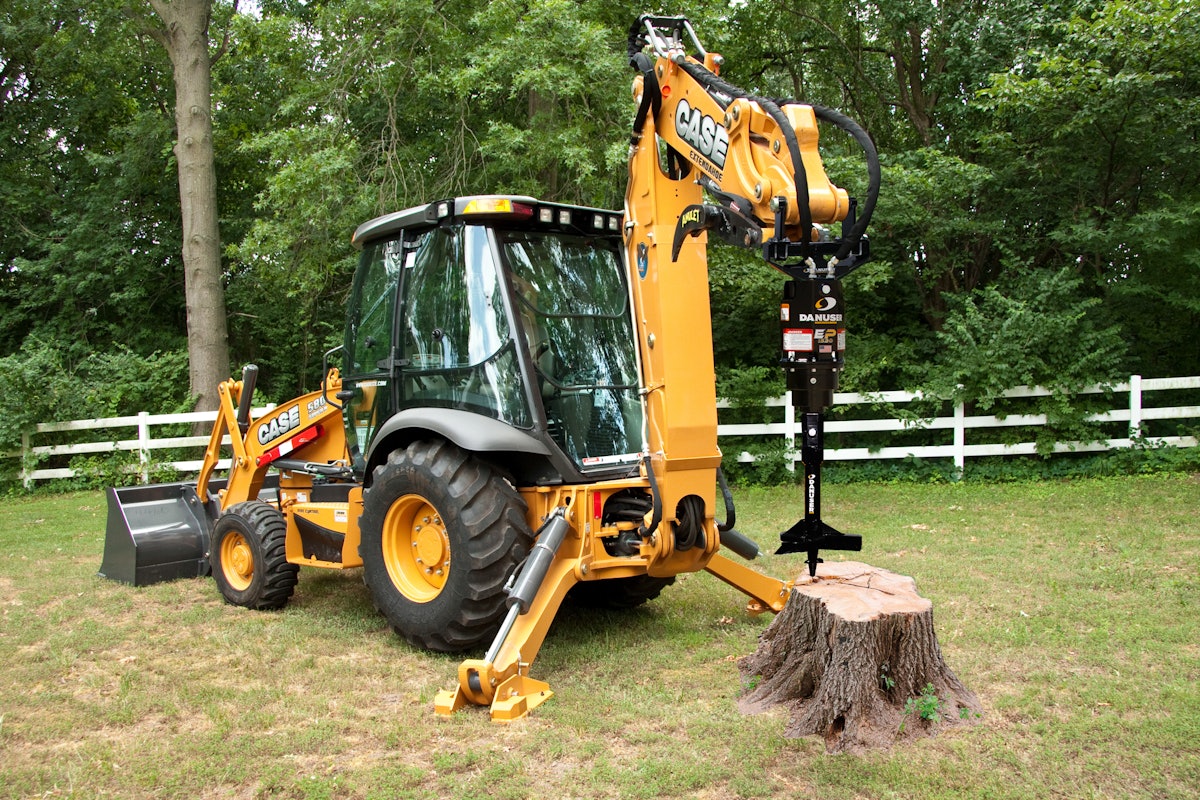 backhoe digging stumps